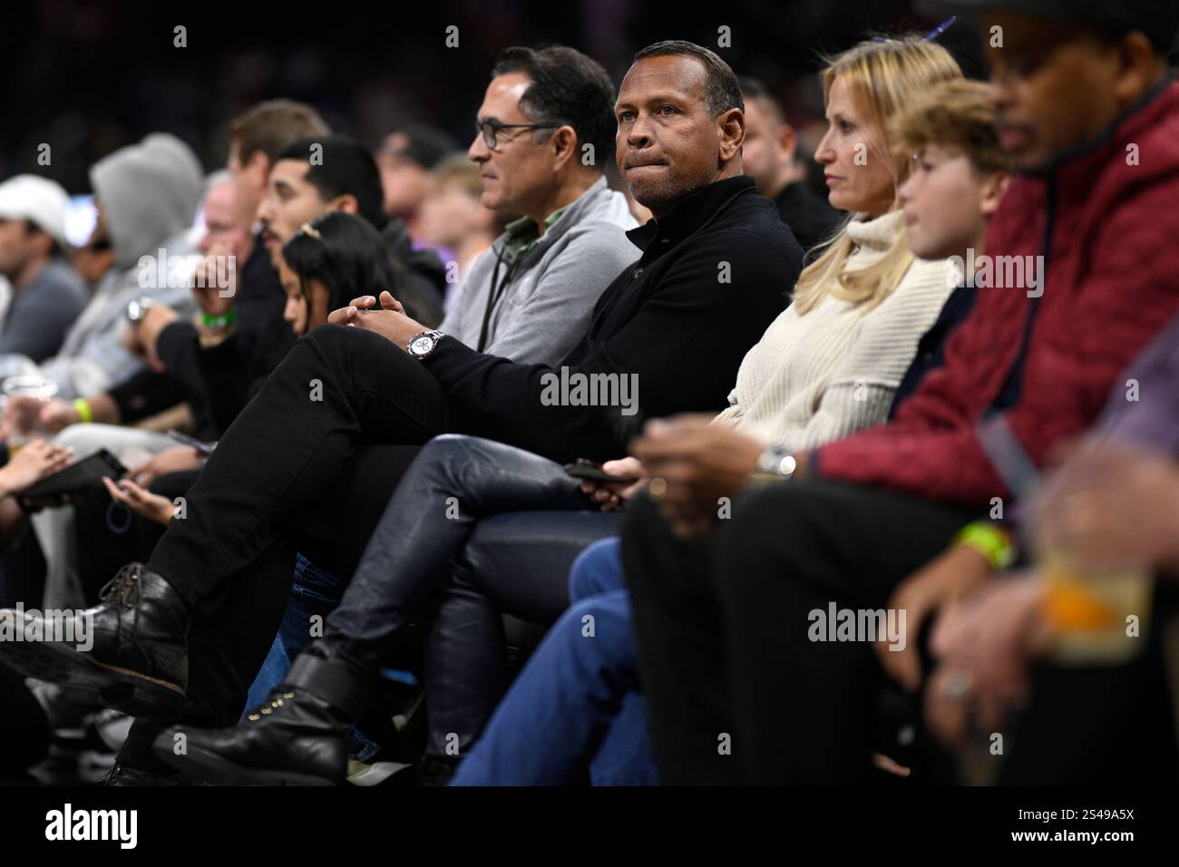 Minnesota Timberwolves minority owner Alex Rodriguez, center, looks on ...