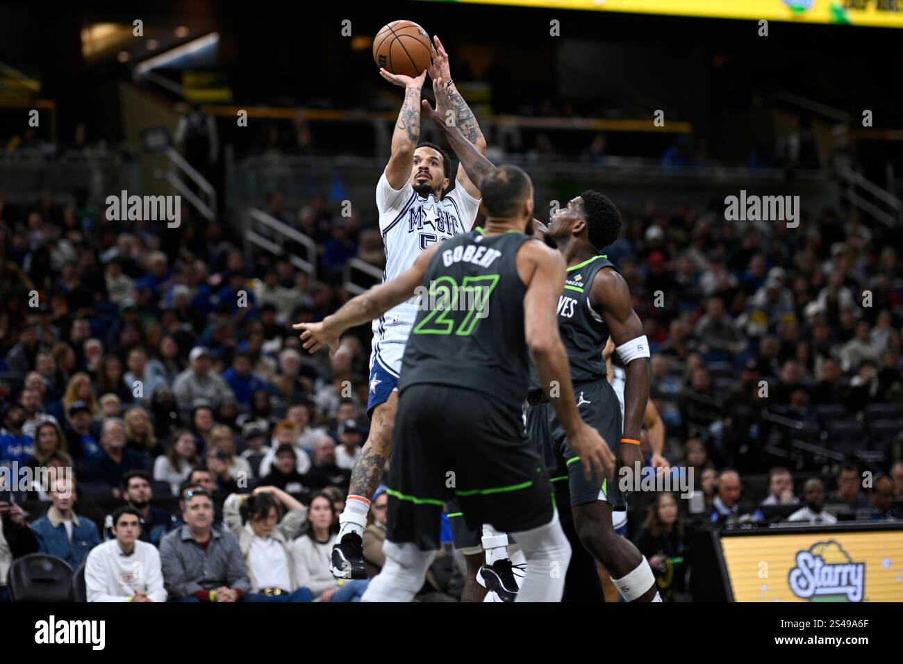 Orlando Magic guard Cole Anthony, rear, shoots in front of Minnesota ...