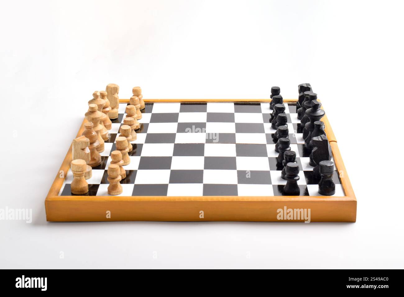 Wooden chessboard with chess pieces ready for the game isolated on ...