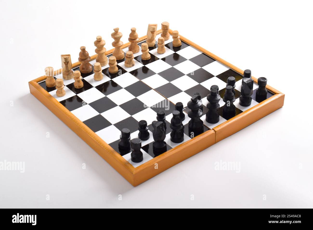 Wooden chessboard with chess pieces ready for the game isolated on ...