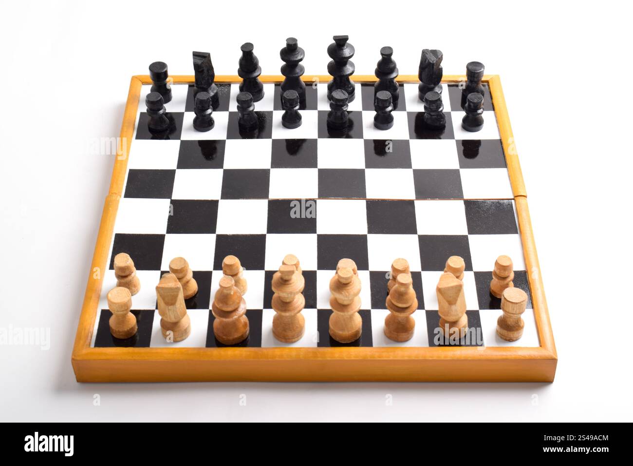 Wooden chessboard with chess pieces ready for the game isolated on ...