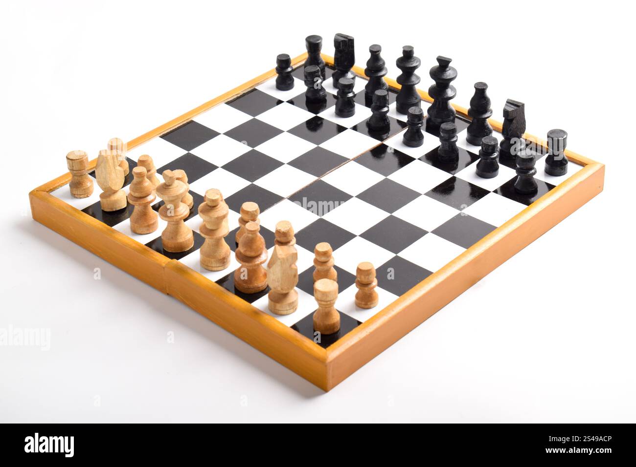 Wooden chessboard with chess pieces ready for the game isolated on ...