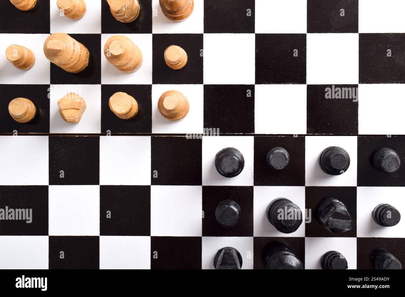 Top view of set of black and white chess pieces, pawn standing on chess ...