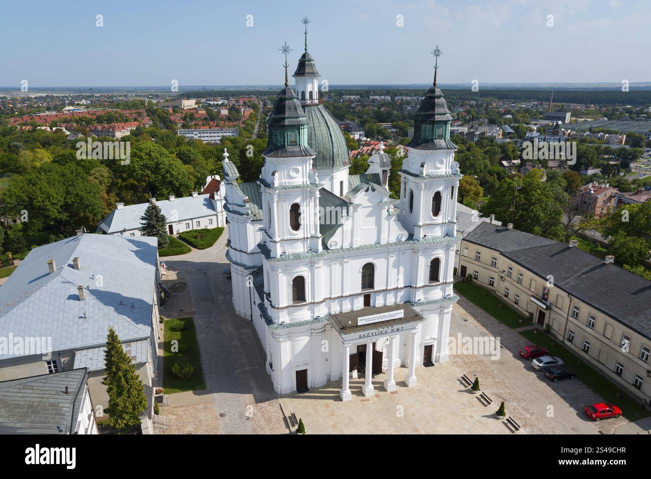 Aerial view of a baroque church and surroundings in a green landscape ...