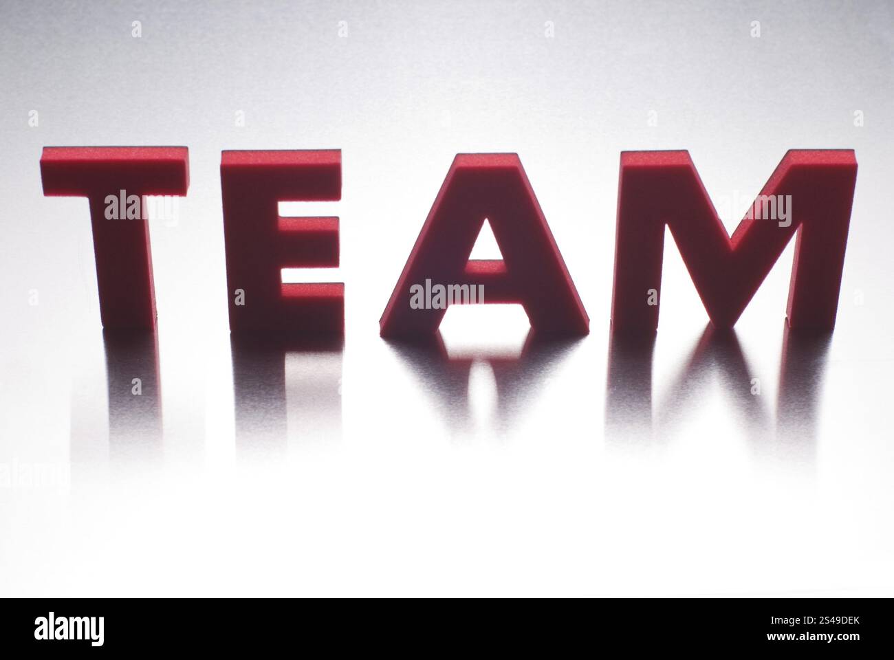 Team word on metal background, part of a series of business words Stock ...