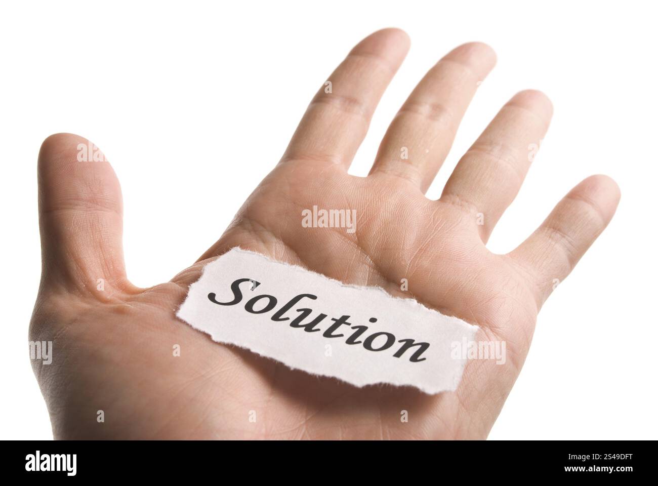 Solution word in hand, word on piece tear paper Stock Photo - Alamy