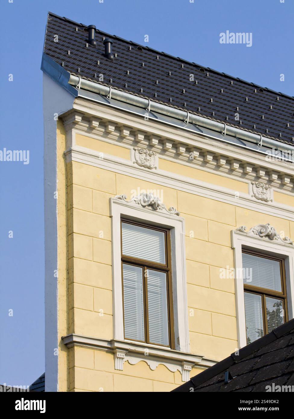 Very narrow residential building. Facade of a renovated house Stock ...