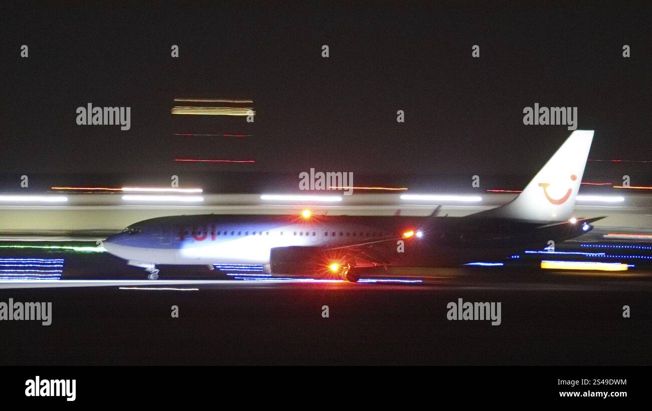 TuiFly Boeing 737 landing at night at Stuttgart Airport Stock Photo - Alamy