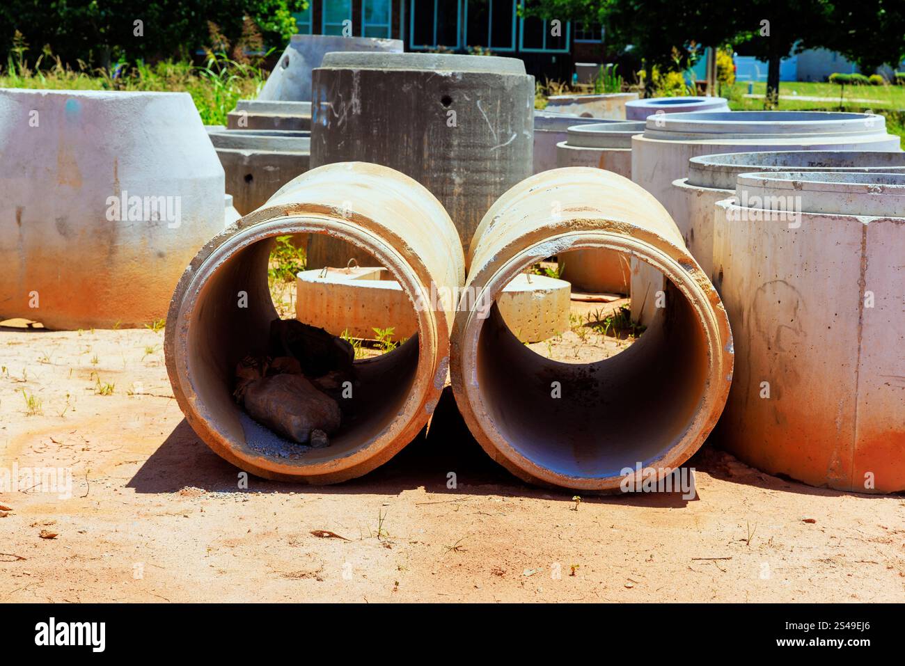 Concrete pipes are scattered in construction area with ready for ...