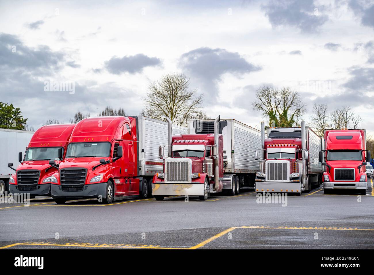 Industrial grade red and burgundy big rig long haul semi trucks tractor ...