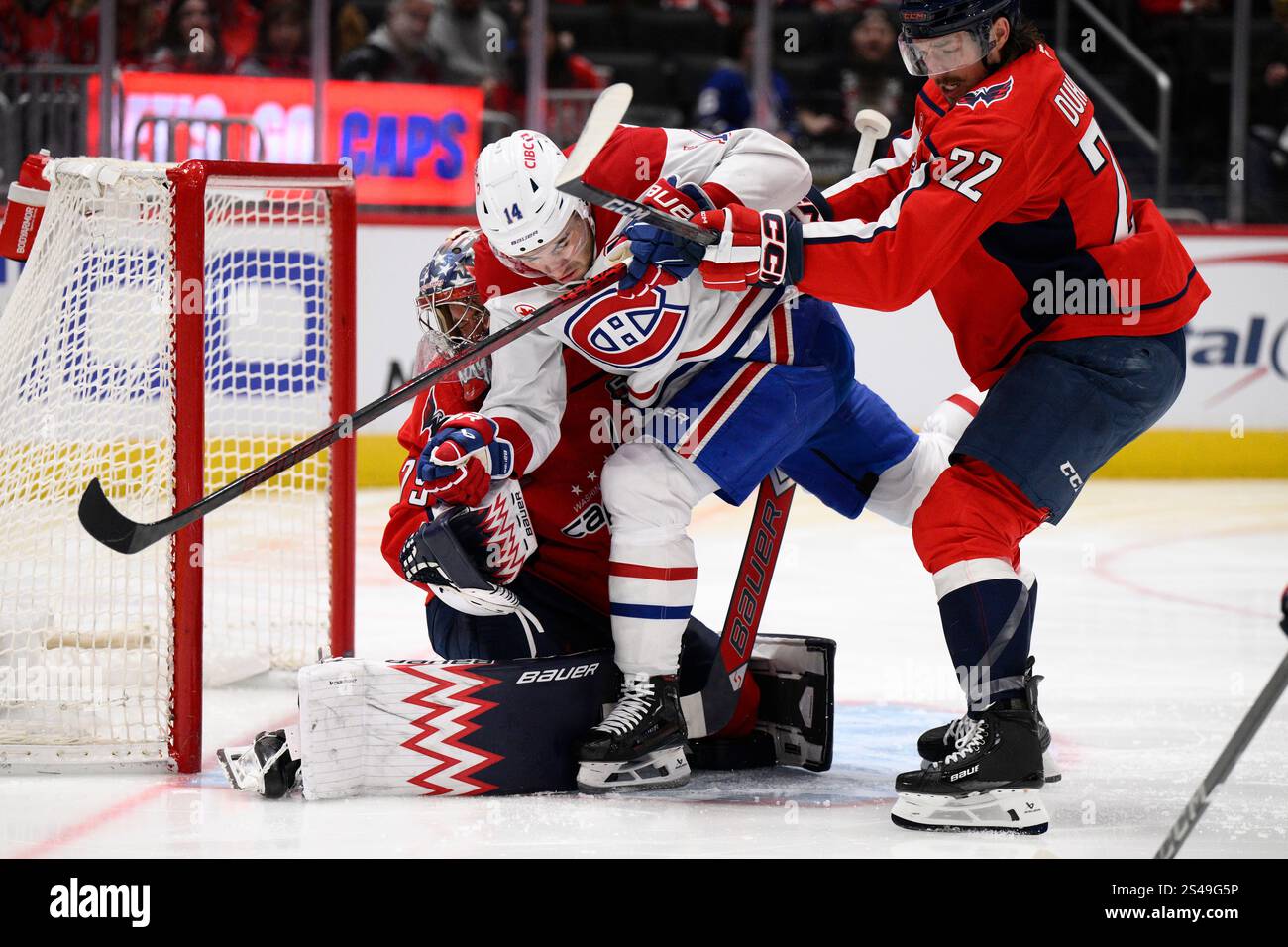 Montreal Canadiens center Nick Suzuki (14) collides with Washington ...