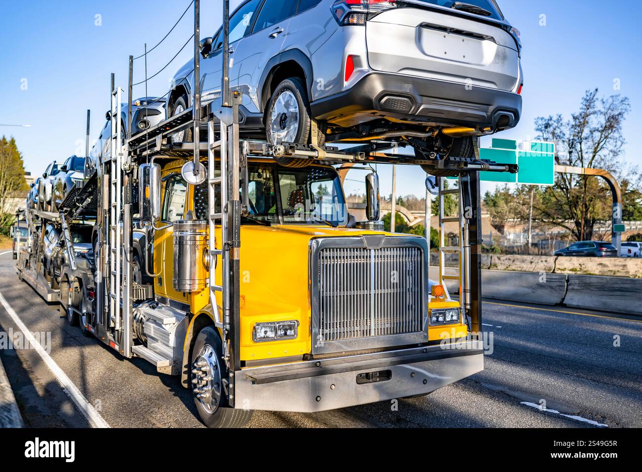 Industrial yellow big rig long haul car hauler semi truck with extended ...