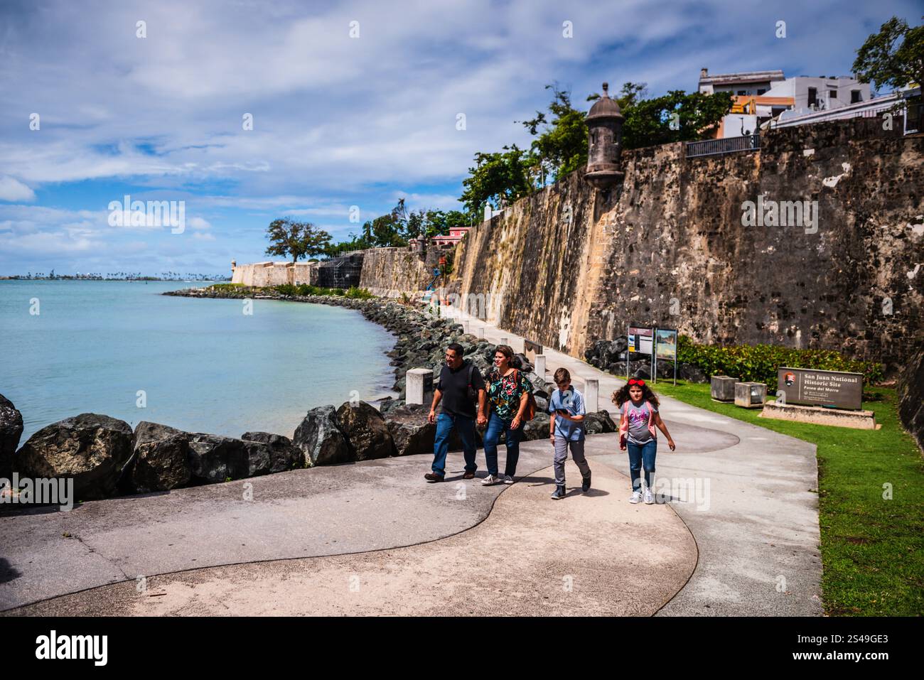 San Juan, Puerto Rico - February 25, 2018: Family walking on Paseo del ...