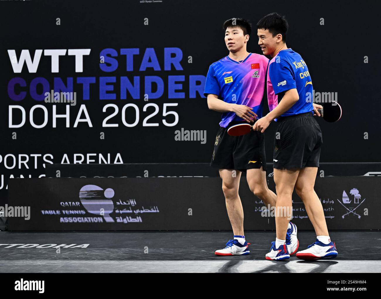 Doha, Qatar. 10th Jan, 2025. Xu Yingbin (L)/Xiang Peng celebrate after ...