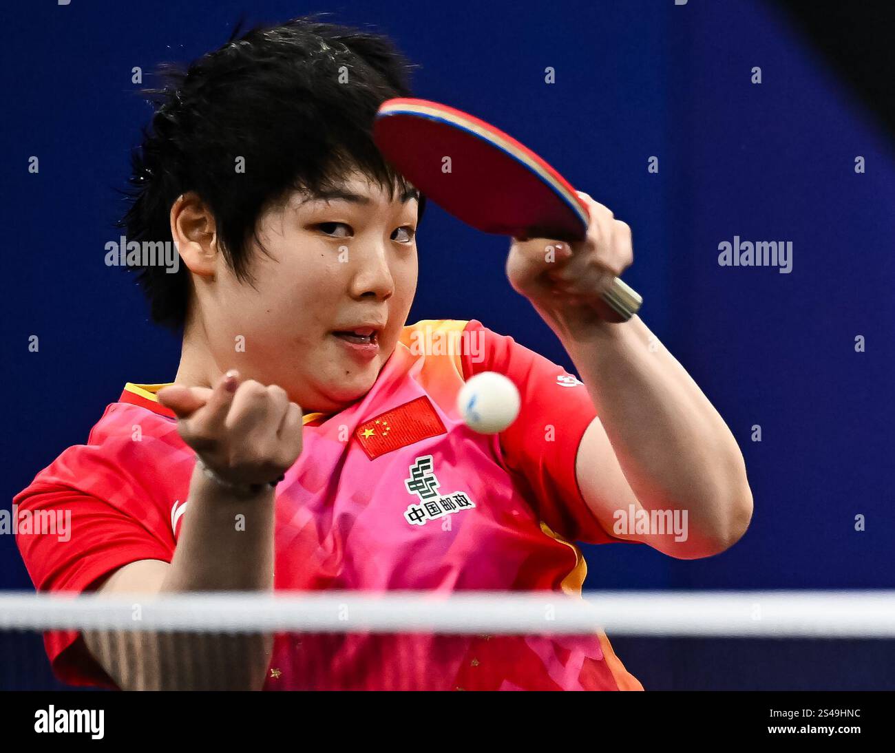 (250111) -- DOHA, Jan. 11, 2025 (Xinhua) -- Kuai Man hits a return ...