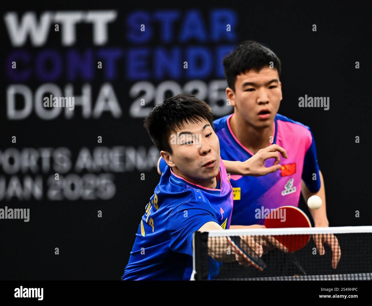 Doha, Qatar. 10th Jan, 2025. Xu Yingbin (L)/Xiang Peng compete during the men's doubles final ...