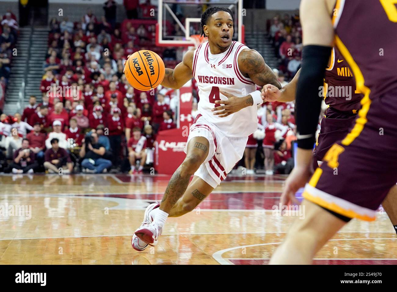 Wisconsin guard Kamari McGee (4) dribbles during the second half of an ...