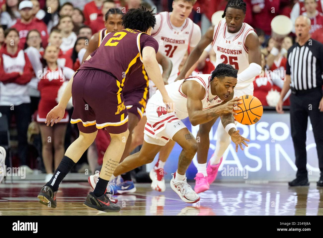 Wisconsin guard Kamari McGee, front right, forces a turnover against ...