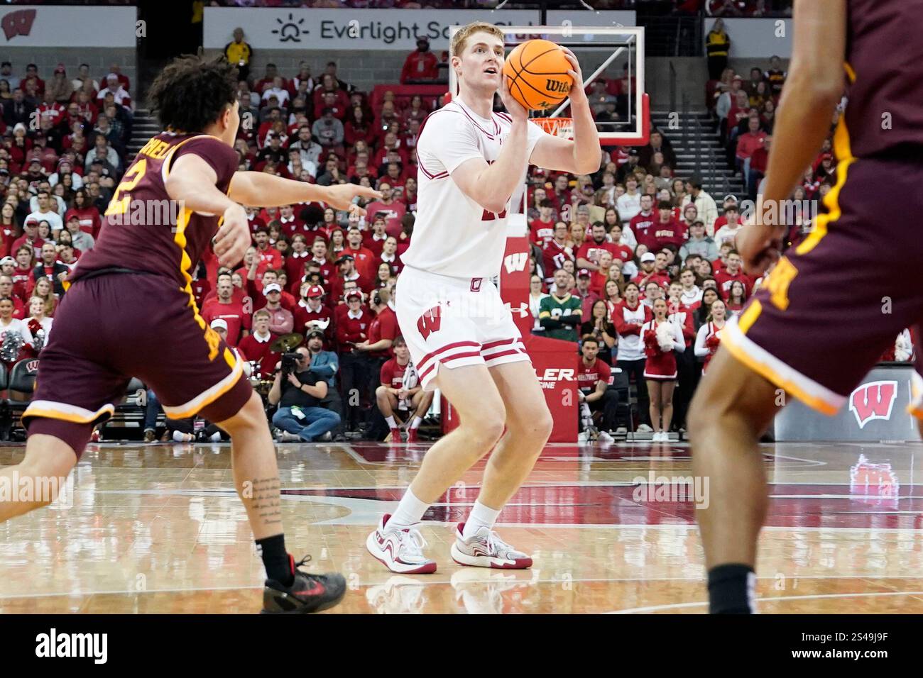 Wisconsin forward Steven Crowl, center, prepares to shoot a 3-point ...