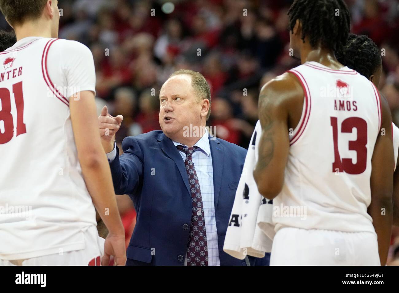Wisconsin head coach Greg Gard, center, talks to his players during a ...