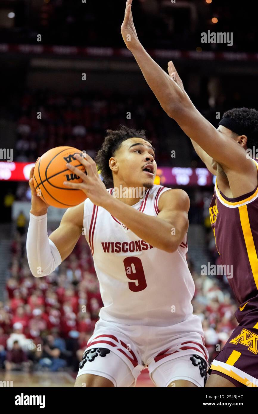 Wisconsin guard John Tonje (9) looks to the basket against Minnesota ...
