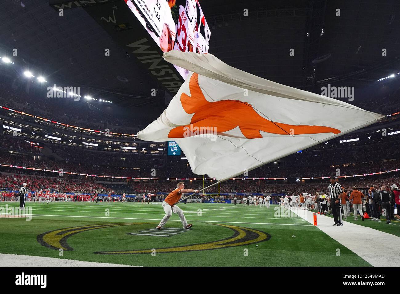 A Texas supporter waves a flag during the first half of the Cotton Bowl ...