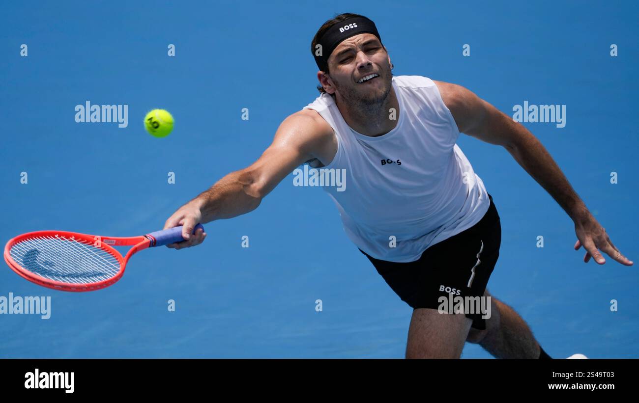 Taylor Fritz of the United States plays a forehand return during a ...