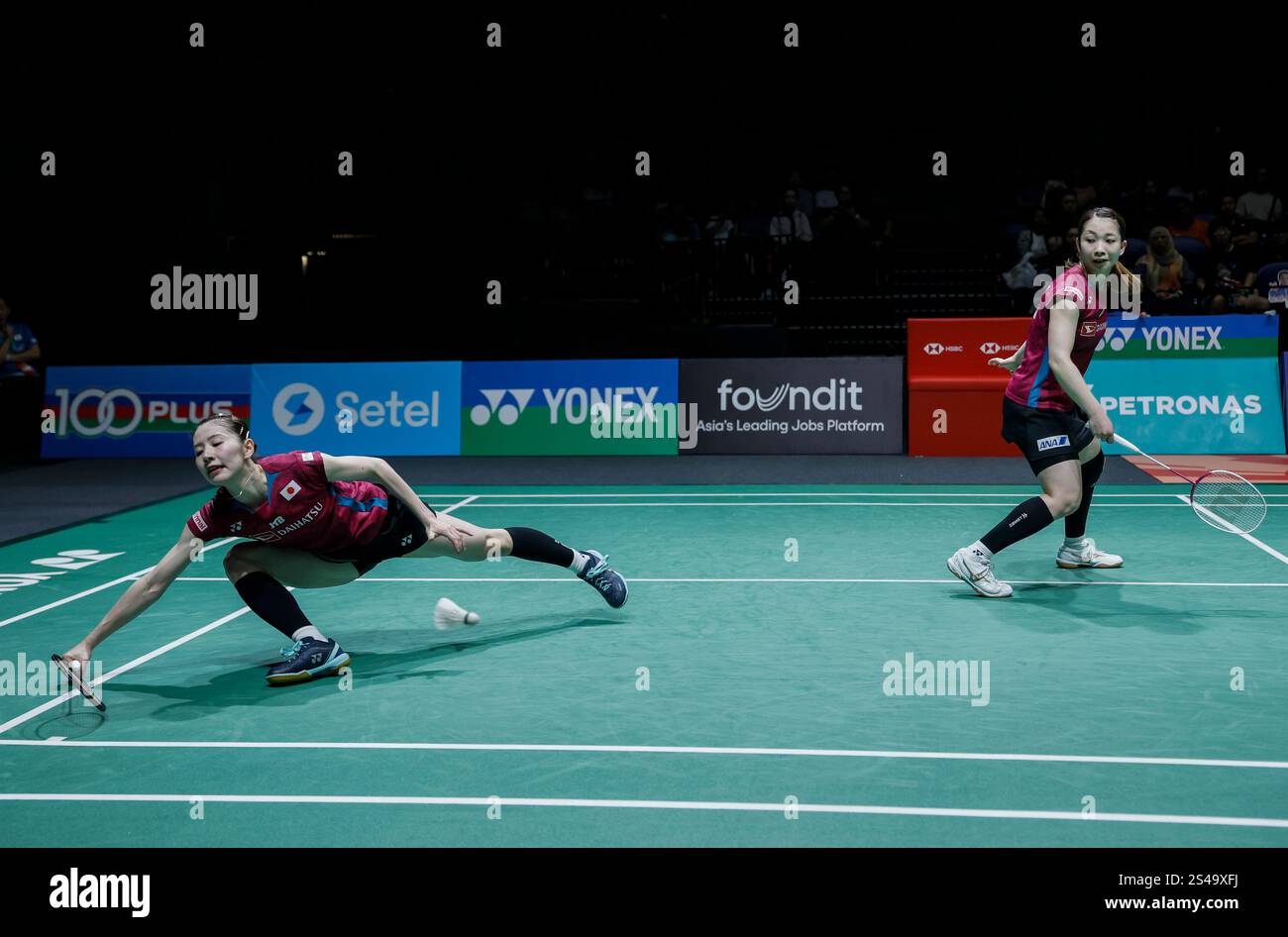 Misaki Matsutomo and Chiharu Shida (L) of Japan play against Li Yi Jing ...