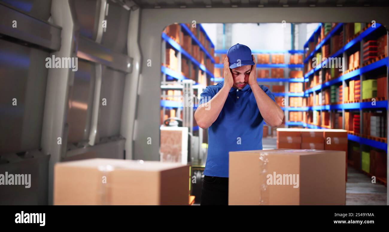 Sad Stressed Delivery Man Loading Van In Warehouse Stock Photo - Alamy