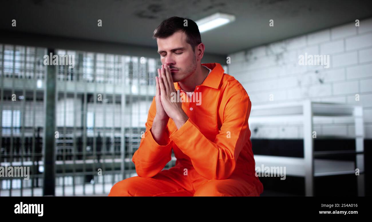 Man Praying To God In Prison Of Jail For Mercy And Freedom Stock Photo ...