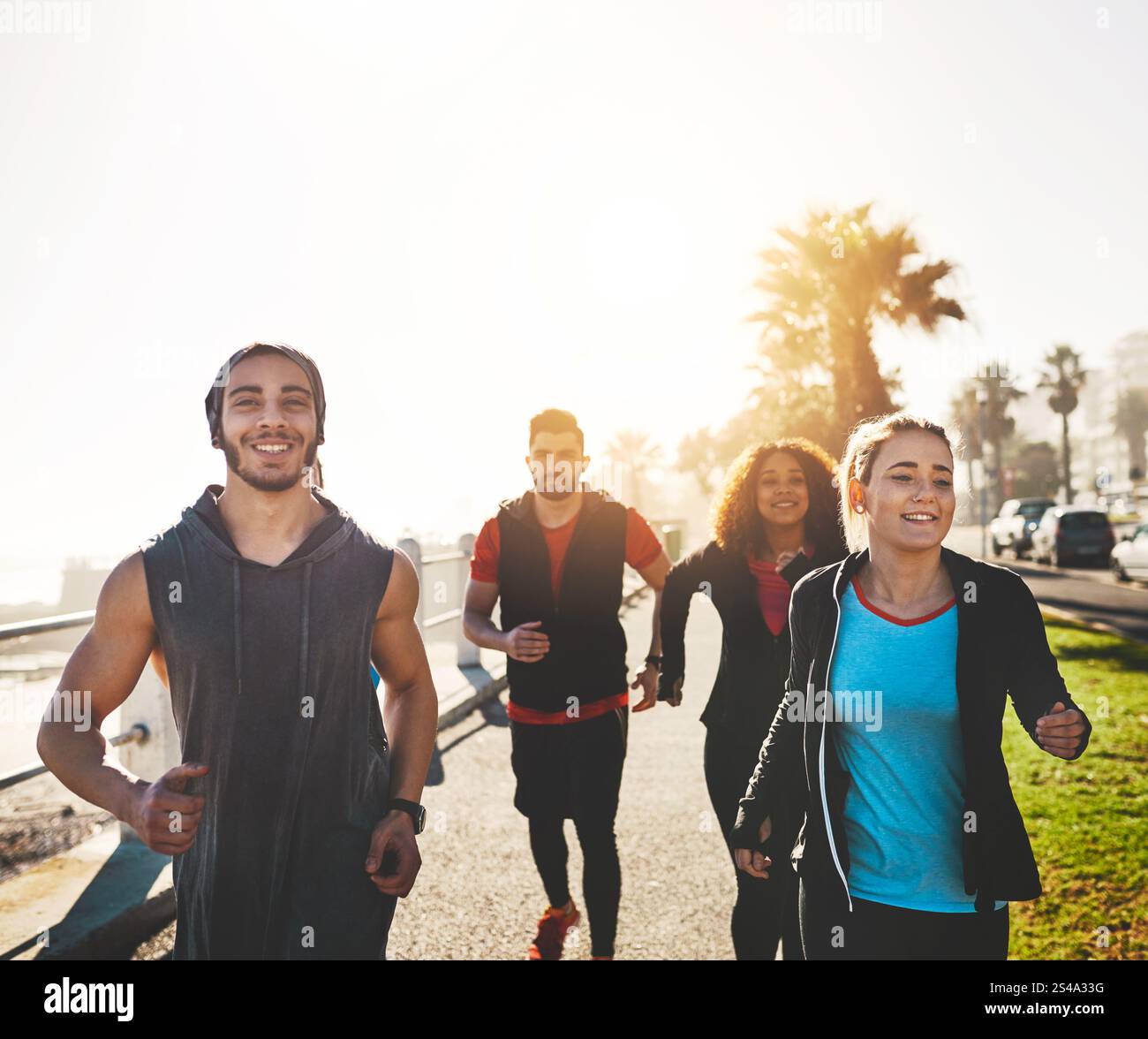 Fitness, health and athletes running by beach for race, marathon or ...