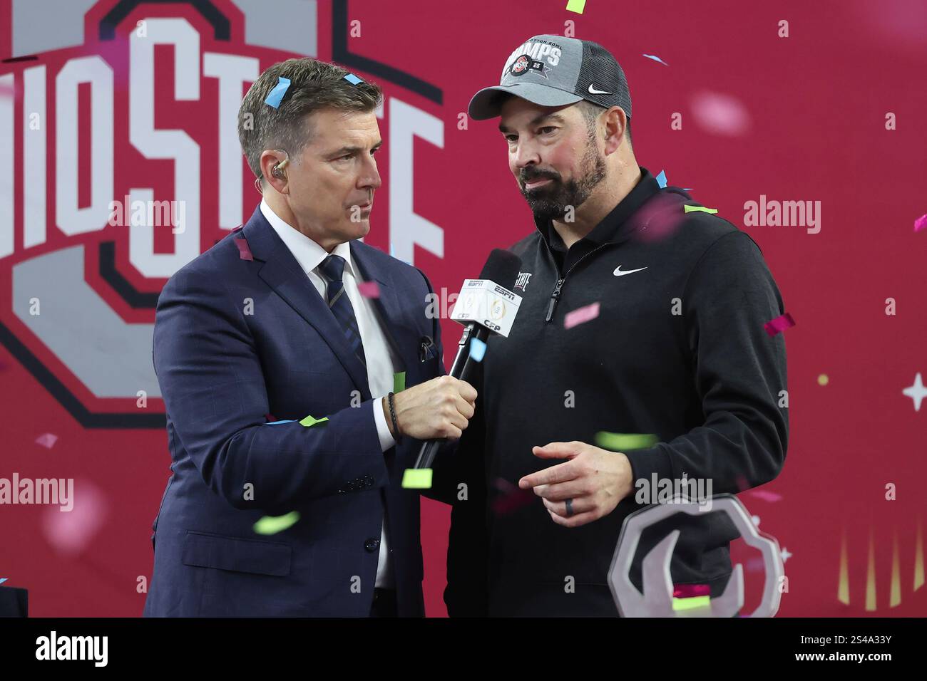 Ohio State head coach Ryan Day, right, is interviewed after the Cotton ...