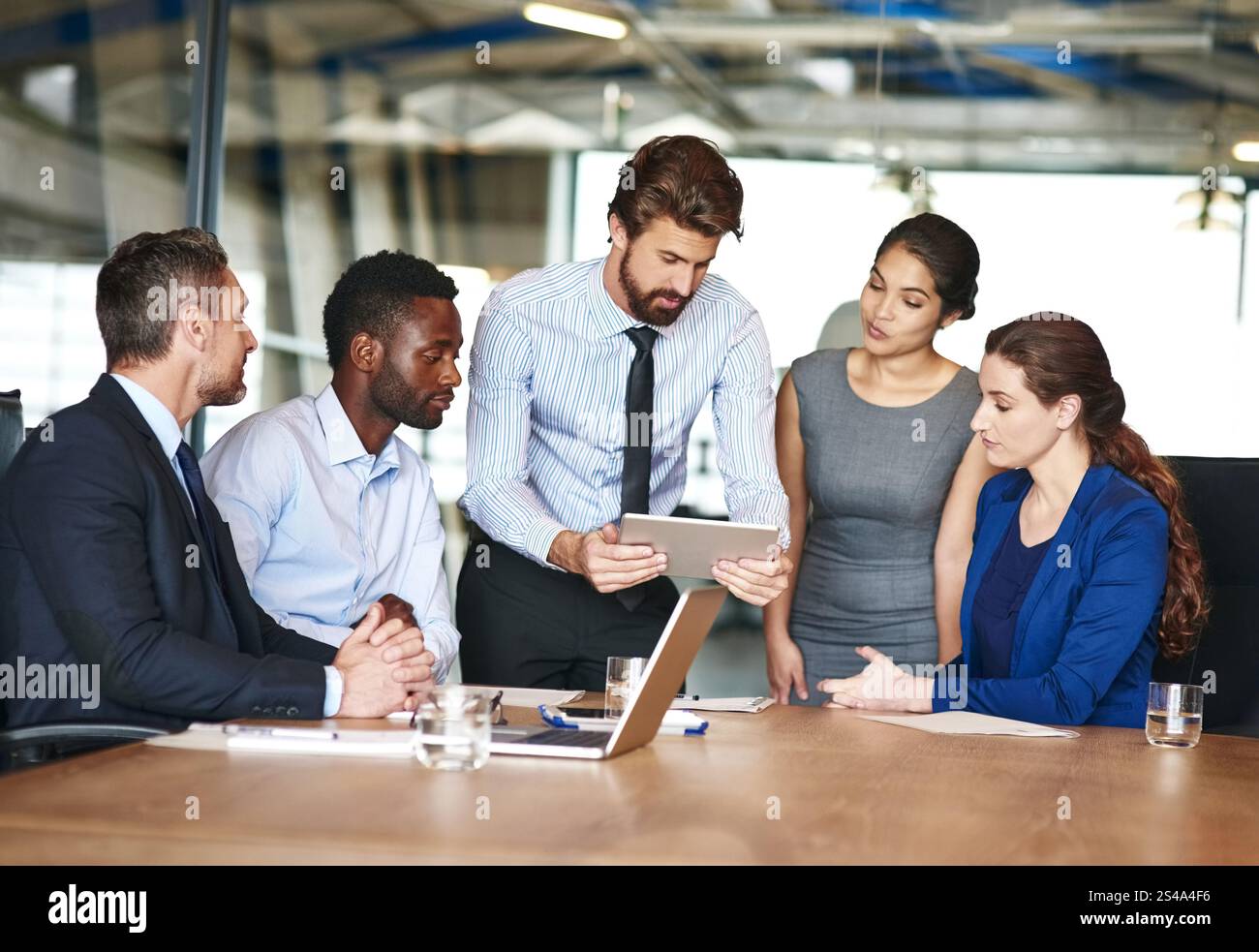 Tablet, finance team and business people planning in meeting with ...