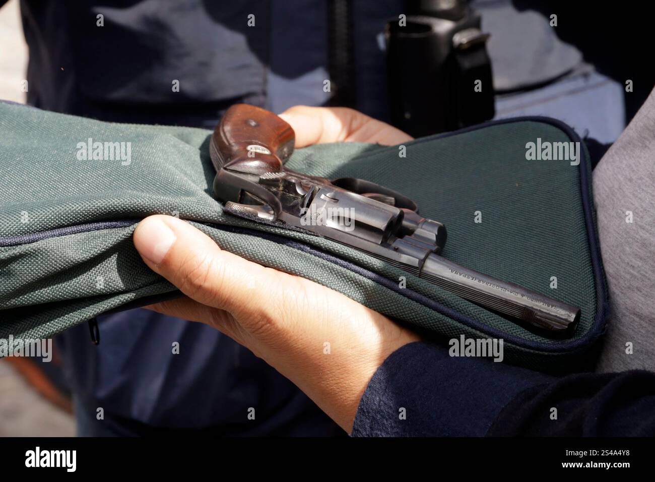 A person holds a gun during the anti-gun campaign “Yes to Disarmament ...