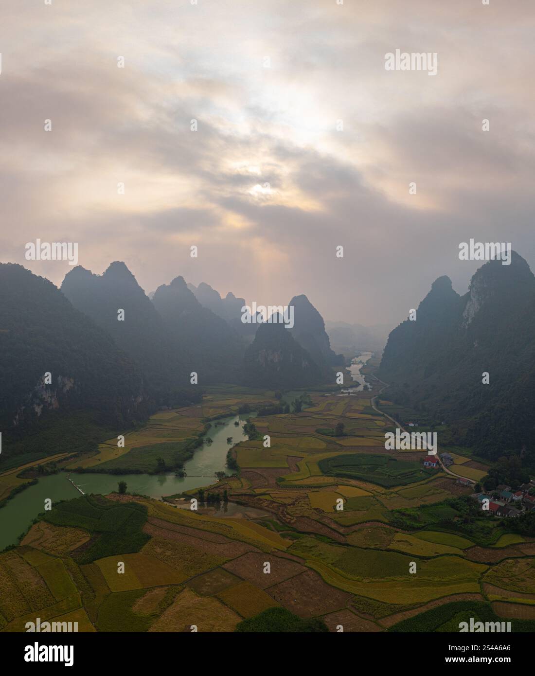 A panoramic aerial view of a lush mountain valley featuring vibrant ...