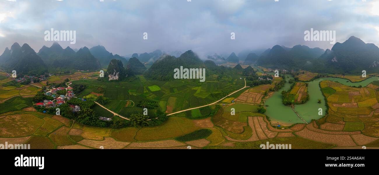 A panoramic aerial view of a lush mountain valley featuring vibrant ...