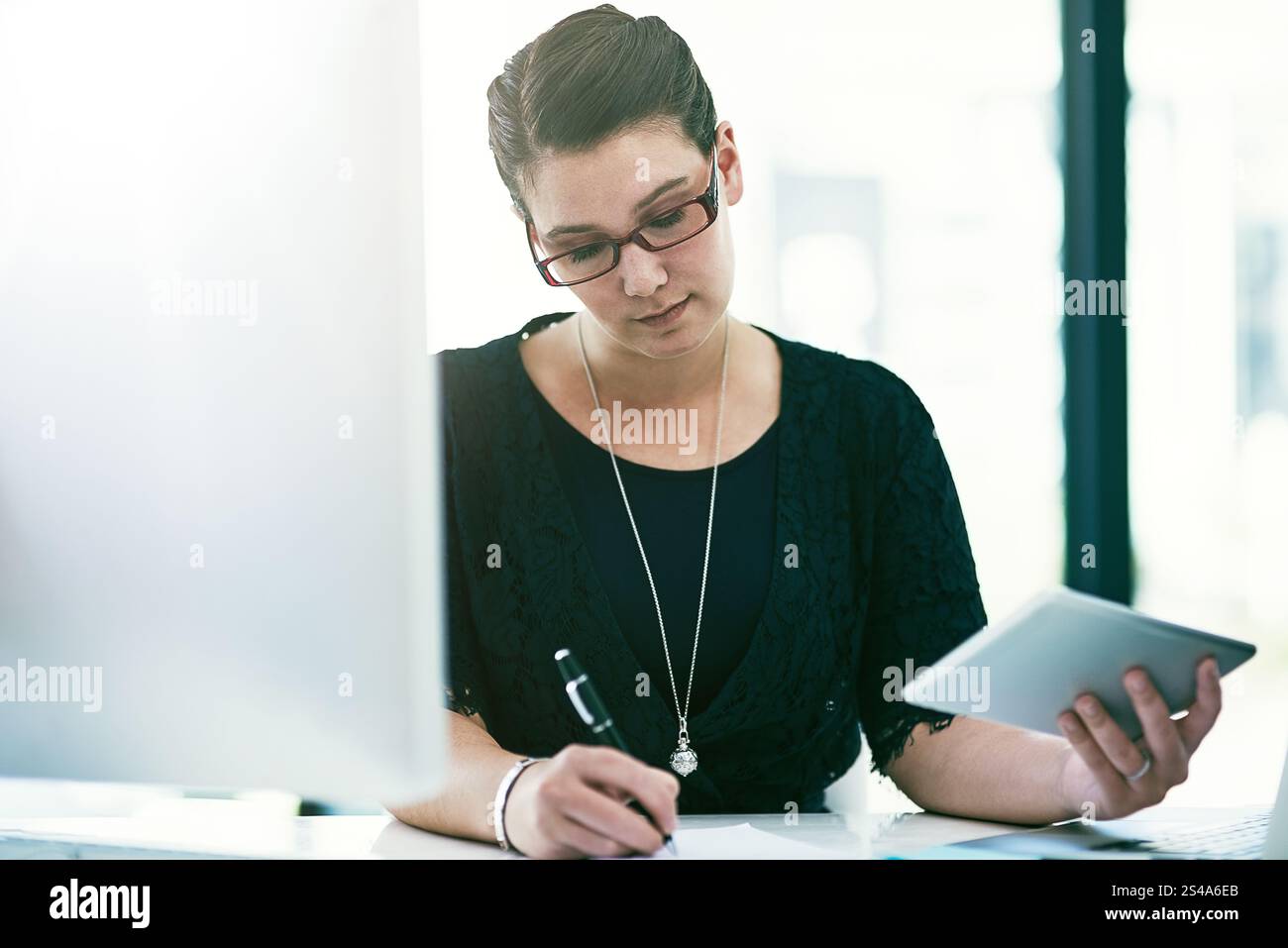 Writing, serious and woman with documents, office and redacting ...