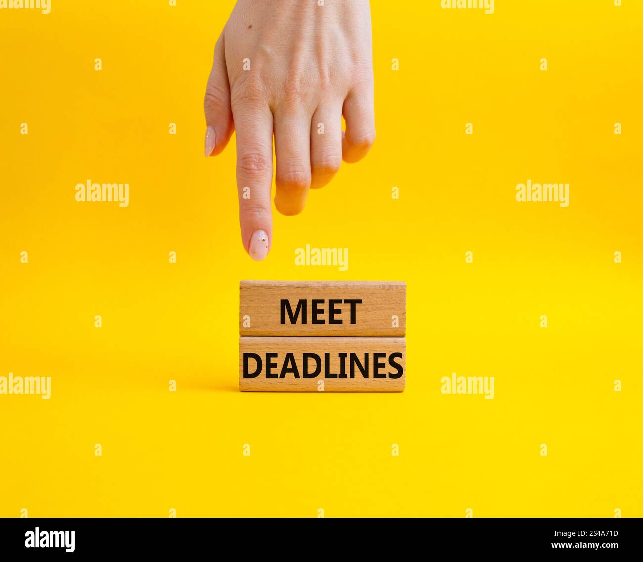 Meet Deadlines symbol. Concept word Meet Deadlines on wooden blocks ...