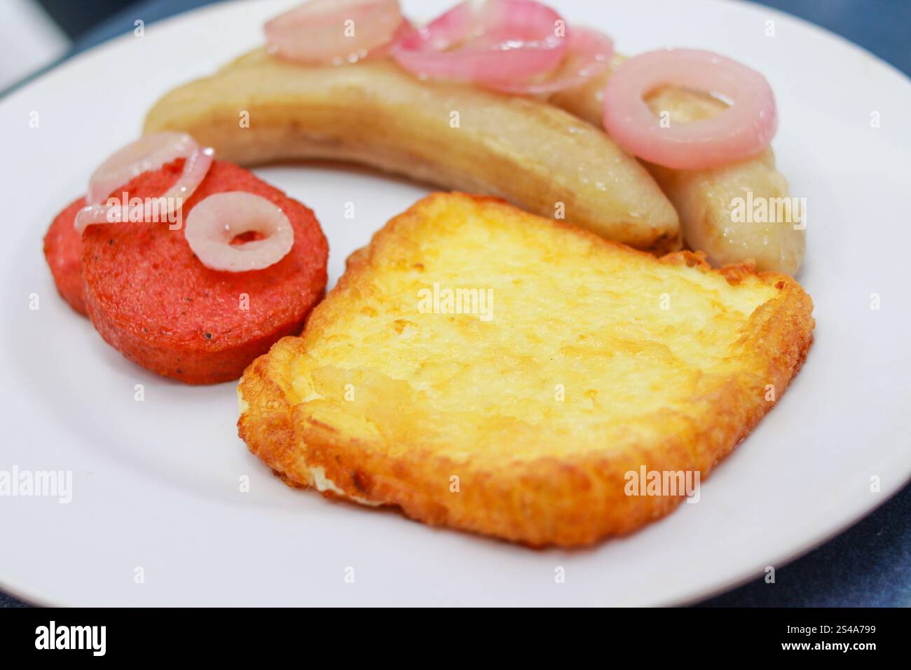 traditional dominican dish of guineitos with salami and fried cheese ...