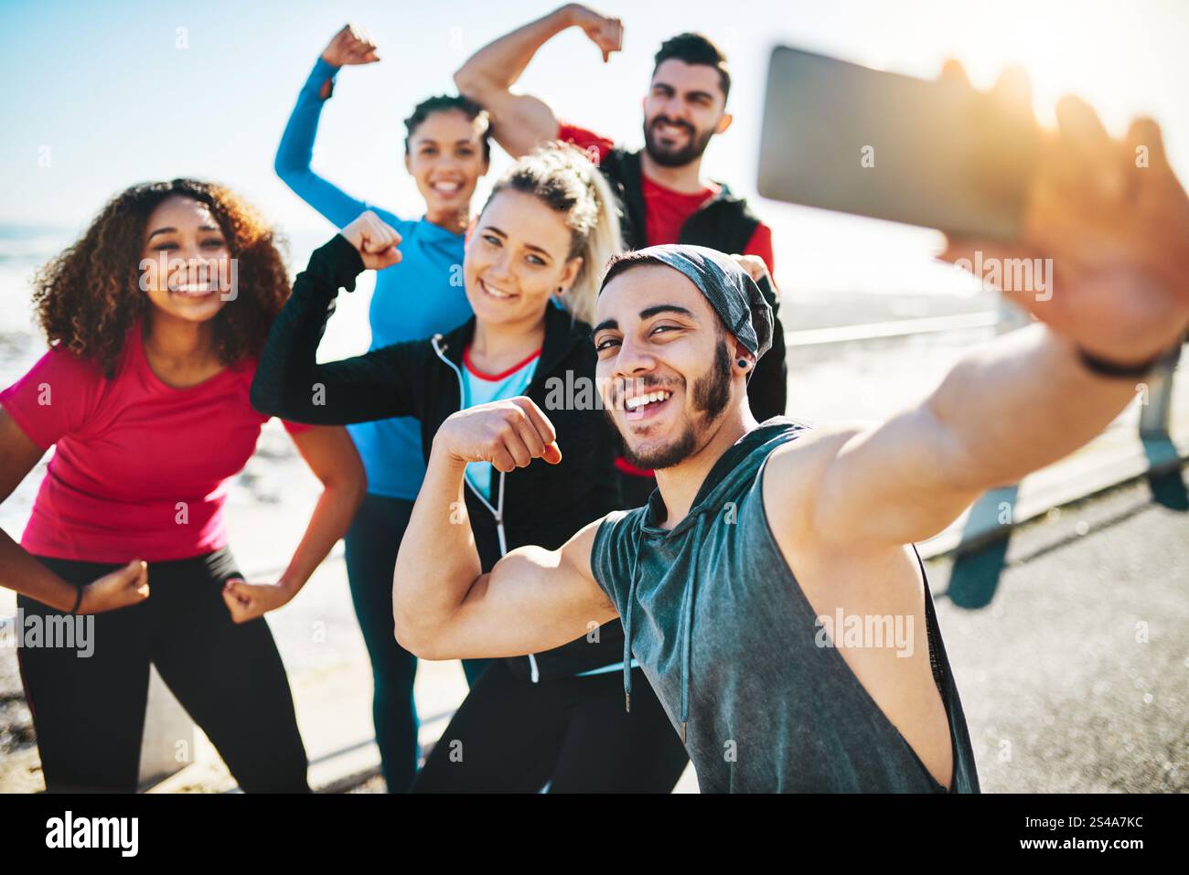 Fitness, selfie and friends flexing by beach running for race, marathon ...