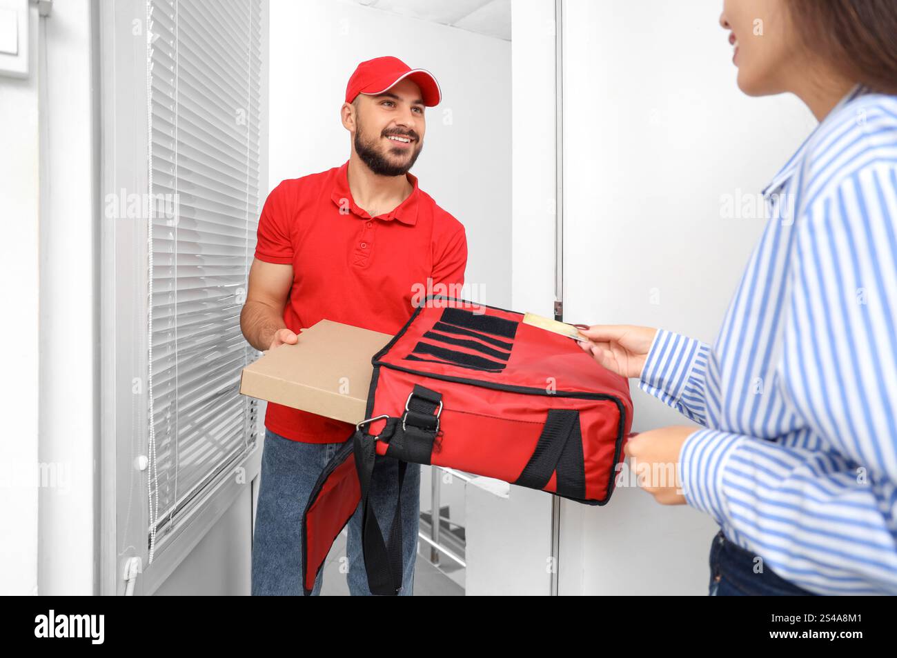 Courier delivery pizza client hi-res stock photography and images - Alamy