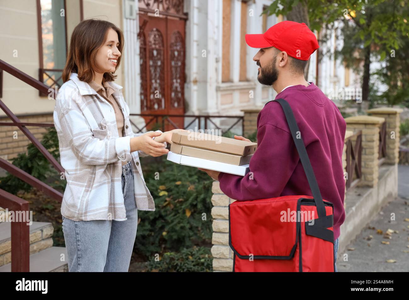 Courier delivering package client outdoors hi-res stock photography and images - Alamy