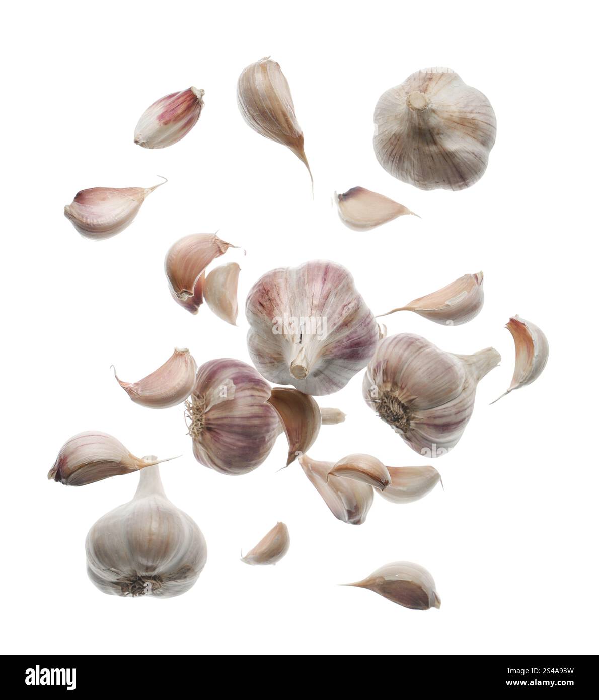 Flying fresh garlic and cloves on white background Stock Photo - Alamy