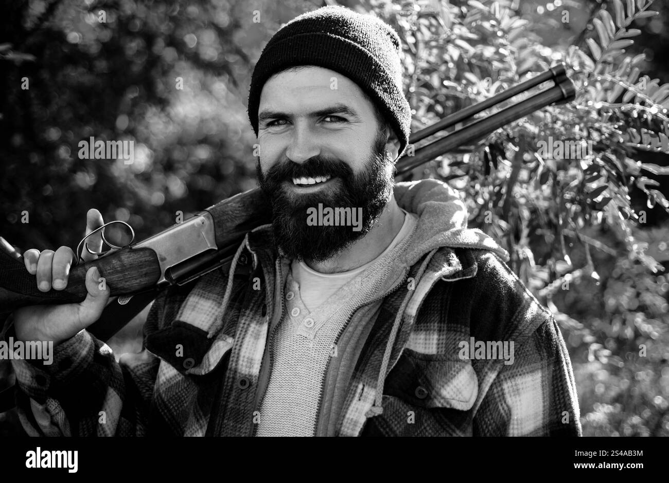 Pictures for Barbershop. Bearded hunter man holding gun and smile ...