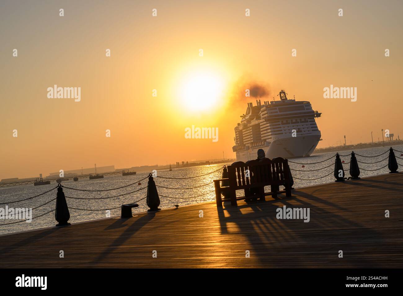 Doha Qatar: A large cruise ship docks in Doha's old port at sunrise ...