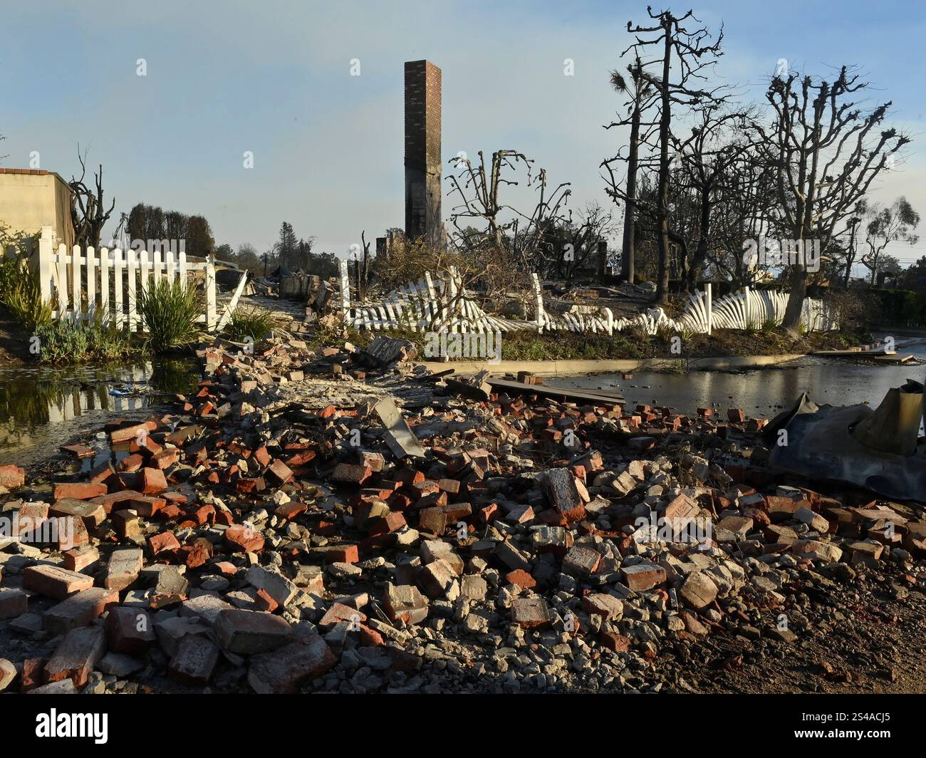 The remains of one of the thousands of structures destroyed by four ...