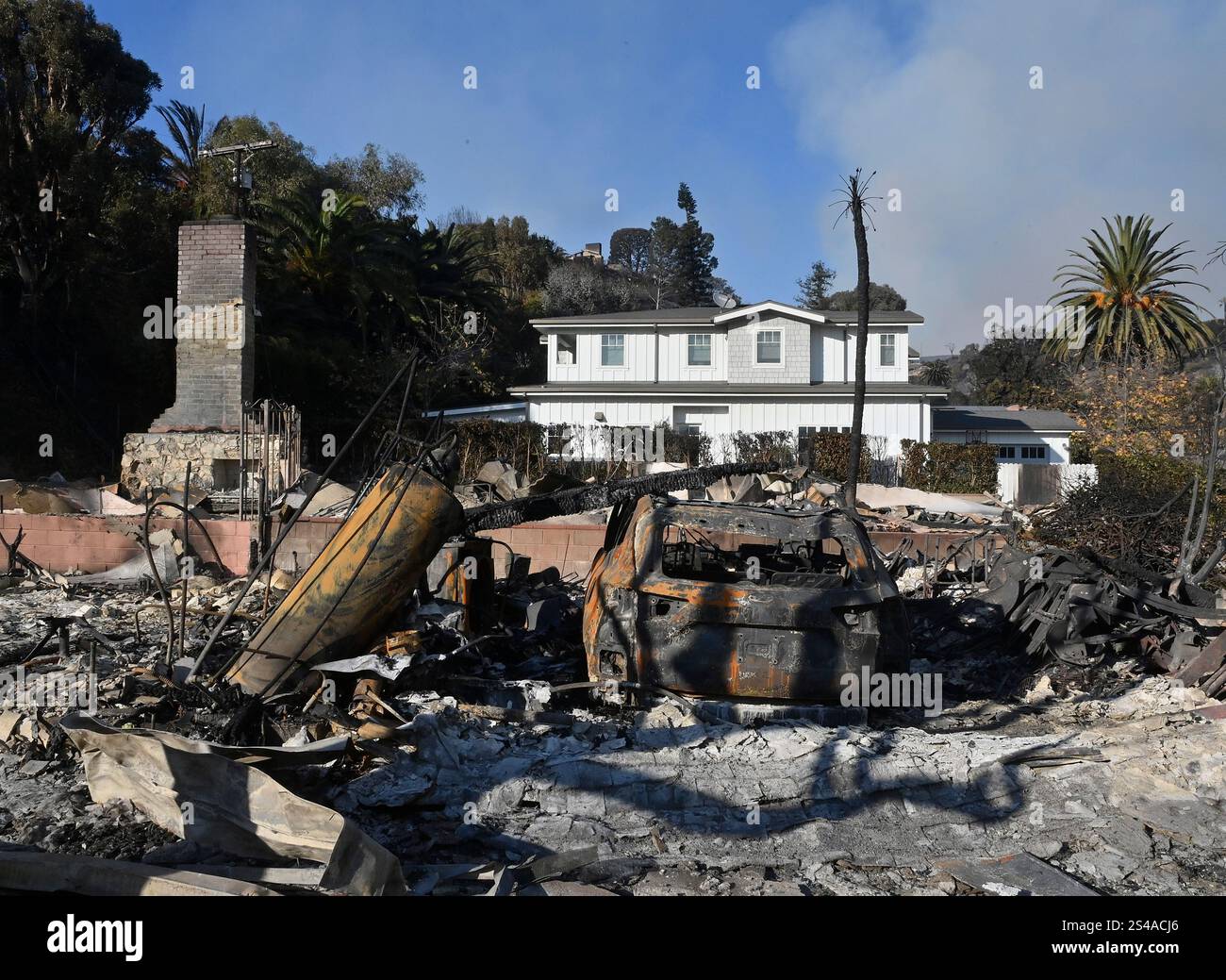 The remains of one of the thousands of structures destroyed by four ...