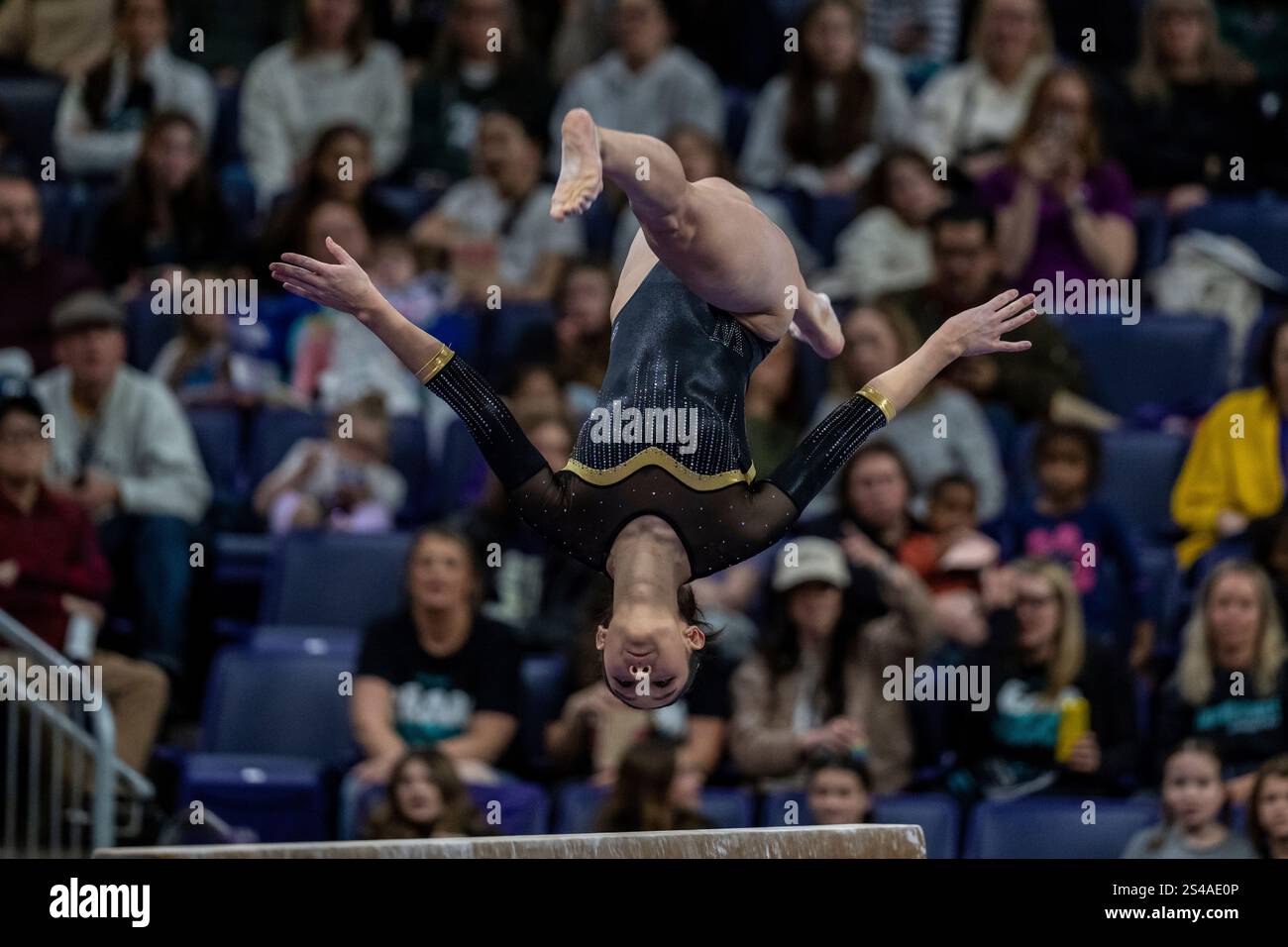 Washington's Taylor Russon competes on the balance beam during an NCAA ...