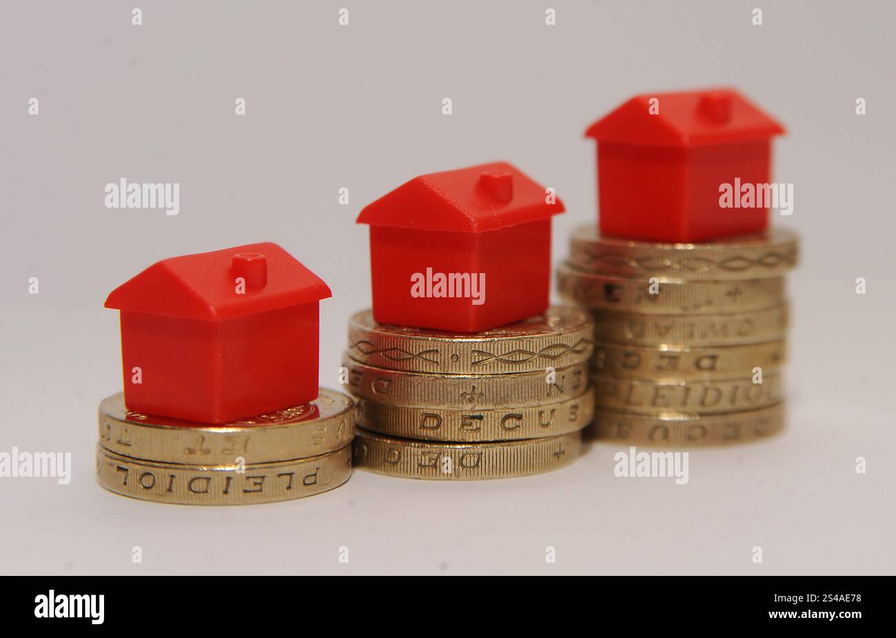 File photo dated 27/01/15 of plastic models of houses sit on a pile of ...