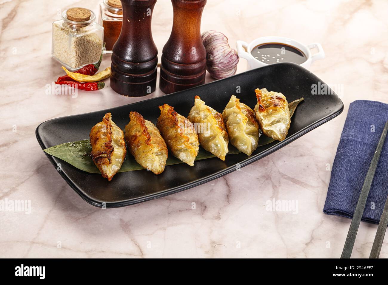 Fried Japanese stuffed dumplings - Gyoza with meat Stock Photo - Alamy